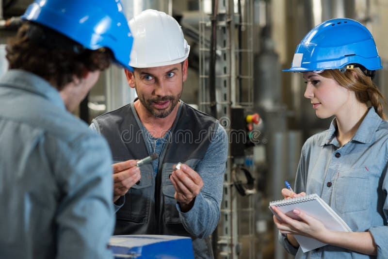 Portrait Engineer and Apprentices in Factory Stock Photo - Image of ...