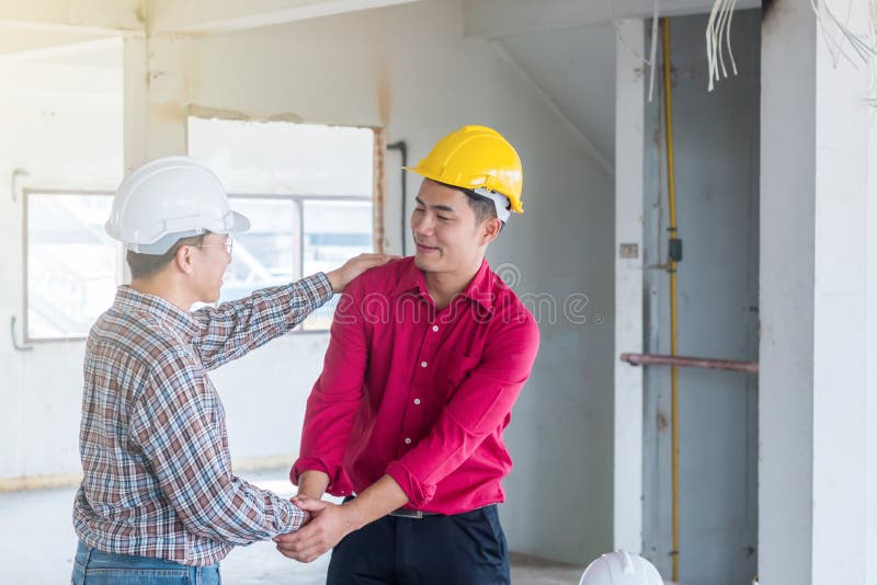Portrait of Engineer Checking the Job and Talking about Project with ...