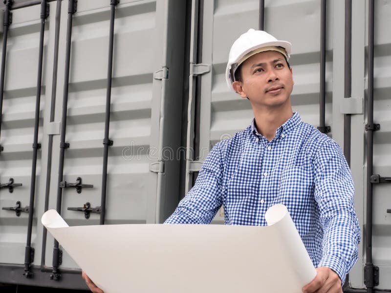 Portrait of an Engineer Man with Helmet Looking Paper Plans at ...