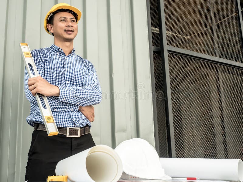 Portrait of an Engineer Man Holding Level Measuring Instrument and ...