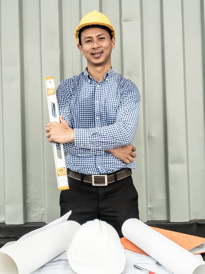 Portrait of an Engineer Man Holding Level Measuring Instrument and ...