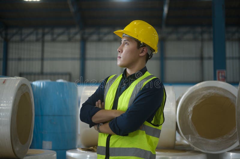Portrait of Engineer Man Putting a Protective Helmet on Head in ...