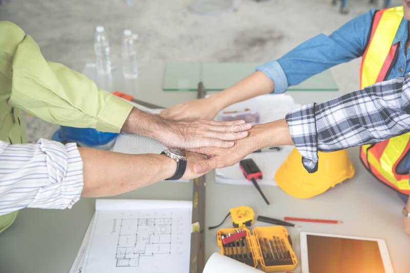 Portrait of Engineer People Stacking Hands after Finish Successful ...