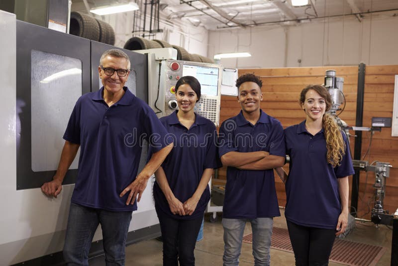 Portrait of Engineer Training Apprentices on CNC Machine Stock Image ...