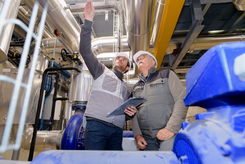 Factory Engineers Studying Plan Stock Photo - Image of studying ...