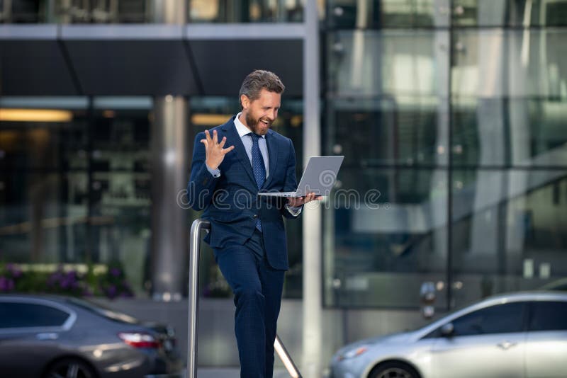 Portrait of Excited Businessman Using Laptop Outdoor. Stock Image ...