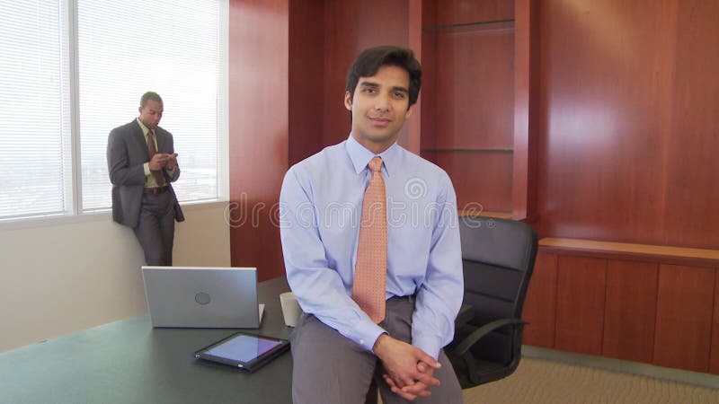 Portrait of Executive in Office with Man in Background Stock Video ...