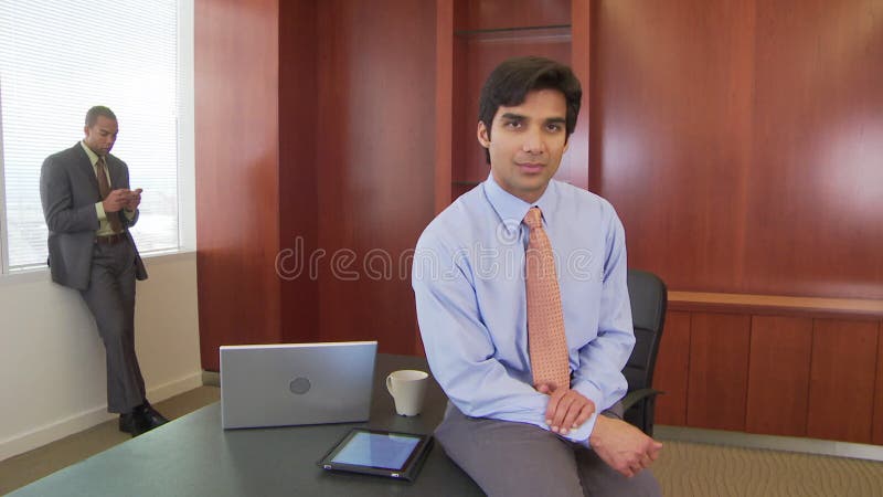 Portrait of Executive in Office with Man in Background Stock Video ...