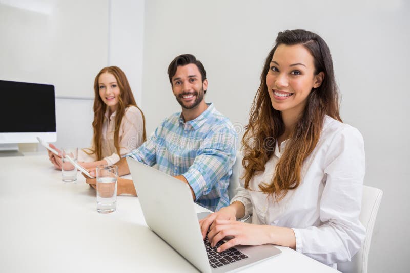 Portrait of Executive Using Laptop and Digital Tablet in Conference ...