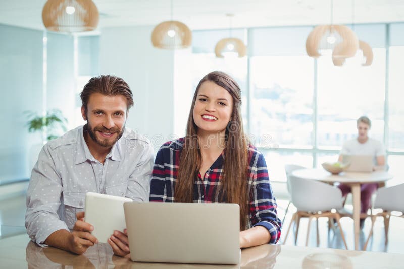 Portrait of Executives Using Laptop and Digital Tablet Stock Image ...