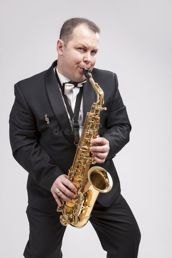 Portrait of Expressive Caucasian Player in Suit Playing on Saxophone ...