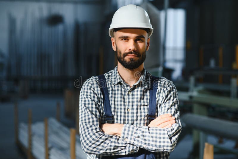 Portrait of Factory Worker in Protective Equipment in Production Hall ...