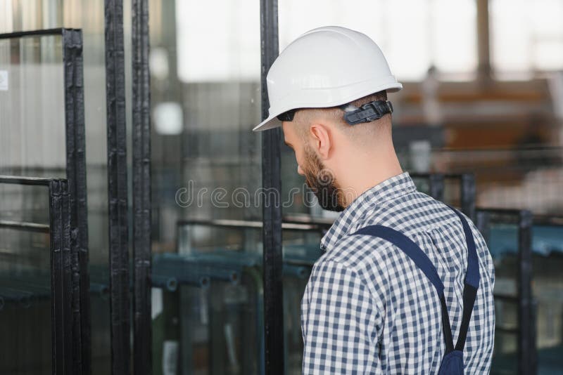 Portrait of Factory Worker in Protective Equipment in Production Hall ...