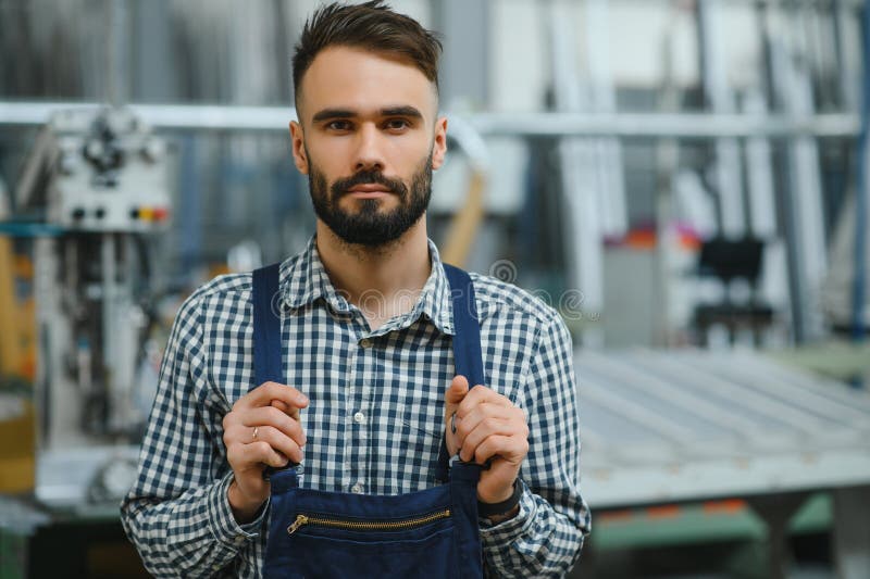 Portrait of Factory Worker in Protective Equipment in Production Hall ...