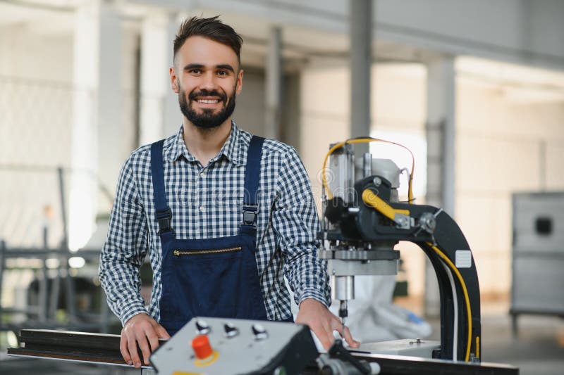 Portrait of Factory Worker in Protective Equipment in Production Hall ...
