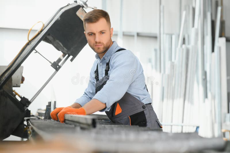 Portrait of Factory Worker. Young Handsome Factory Worker. Stock Photo ...
