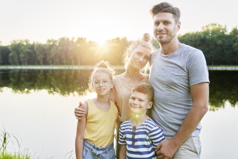 Portrait of Family by the Lake Stock Photo - Image of candid, mobile ...