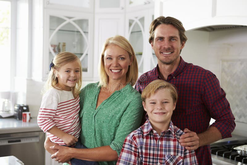 Portrait of Family Standing in Kitchen Together Stock Photo - Image of ...