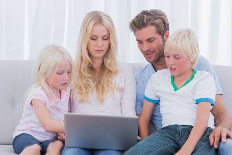 Portrait of a Family Using a Laptop Stock Image - Image of household ...