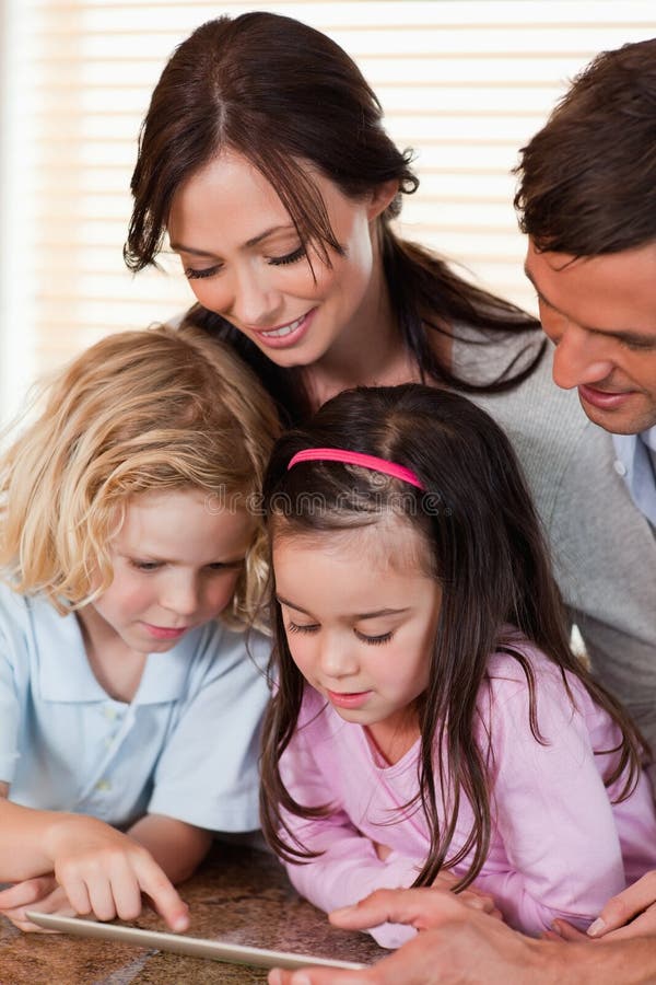 Portrait of a Family Using a Tablet Computer Together Stock Photo ...