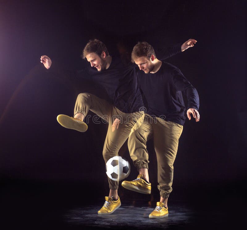 A Portrait of a Fan with Ball on Gray Studio Background. Freestile ...