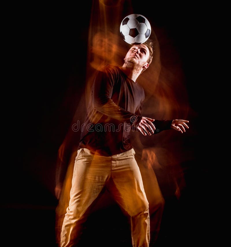 A Portrait of a Fan with Ball on Gray Studio Background. Freestile ...