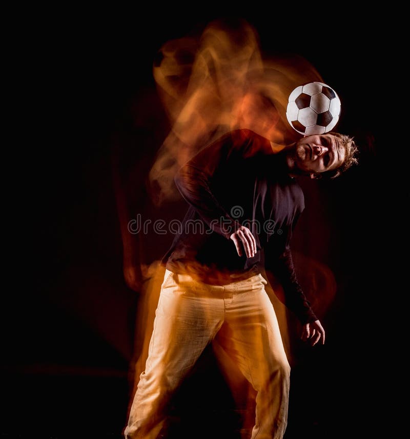 A Portrait of a Fan with Ball on Gray Studio Background. Freestile ...