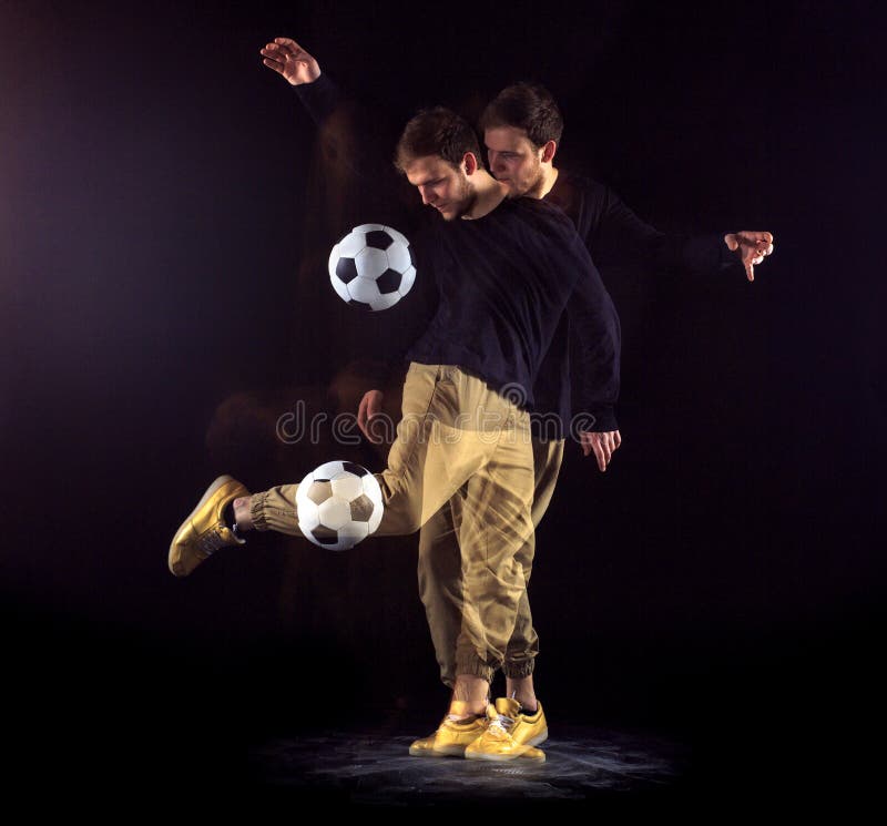 A Portrait of a Fan with Ball on Gray Studio Background. Freestile ...