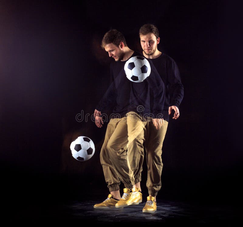A Portrait of a Fan with Ball on Gray Studio Background. Freestile ...
