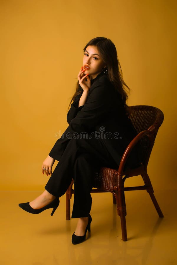Portrait of a Fashion Model in the Studio Dressed in an Elegant Black ...