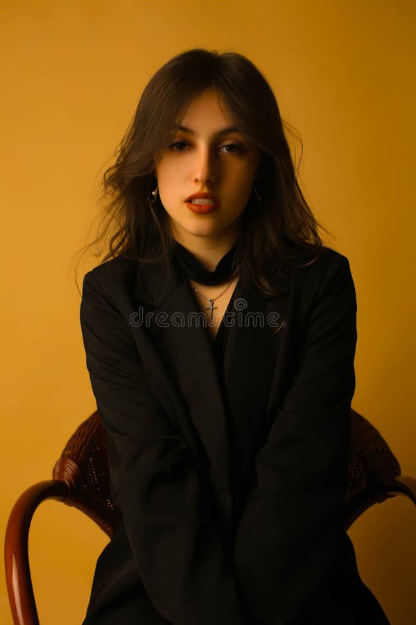 Portrait of a Fashion Model in the Studio Dressed in an Elegant Black ...
