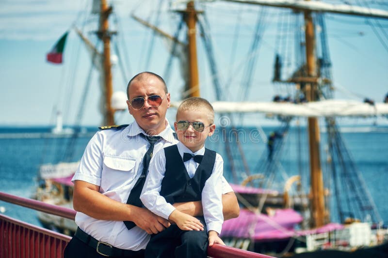 Father and Son in Sailor Uniforms Smiling and Saluting Stock Photo ...