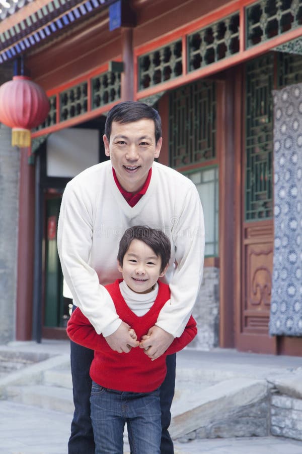 Portrait of Father and Son by a Tradition Chinese Building Stock Photo ...