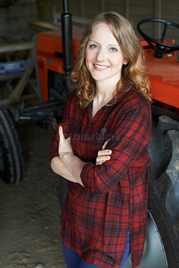 Portrait of Female Agricultural Worker with Tractor Stock Photo - Image ...