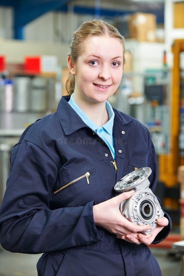 Portrait of Female Apprentice Holding Component Stock Photo - Image of ...