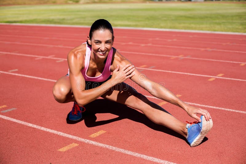 Portrait of Female Athlete Stretching Her Hamstring Stock Image - Image ...