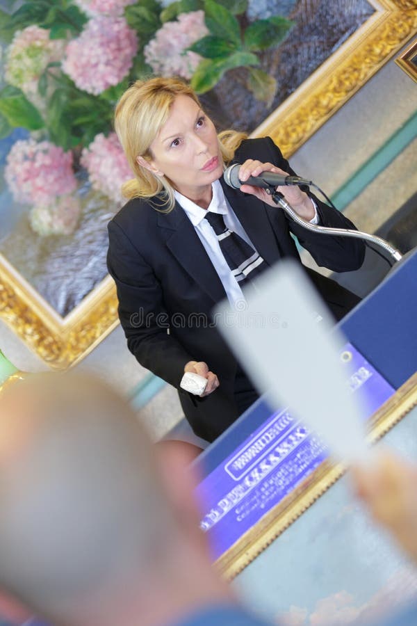 Portrait female auctioneer stock photo. Image of bill - 301295404