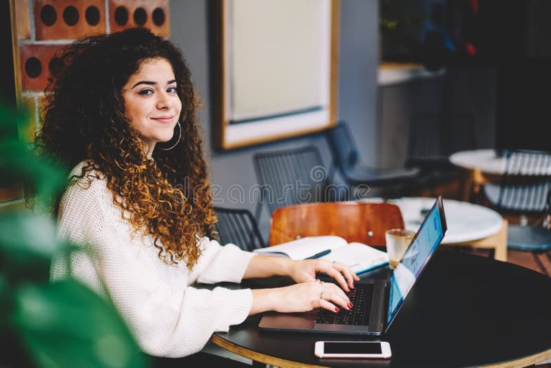 Portrait of Female Blogger Working Remotely in Cafe Interior Using ...