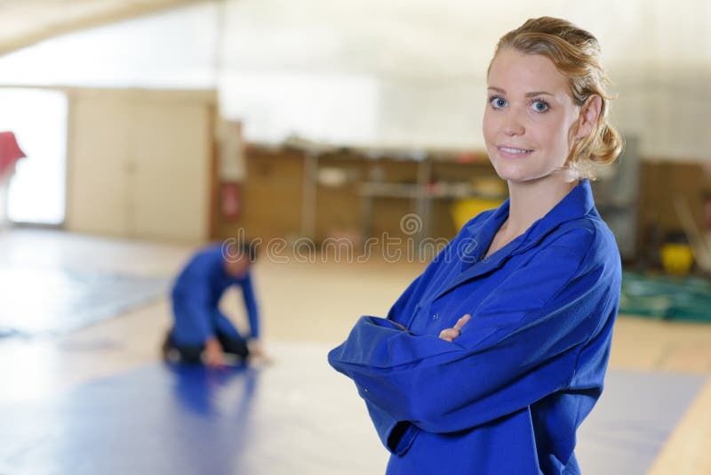 Portrait Female in Blue Overalls Stock Image - Image of floor, overalls ...