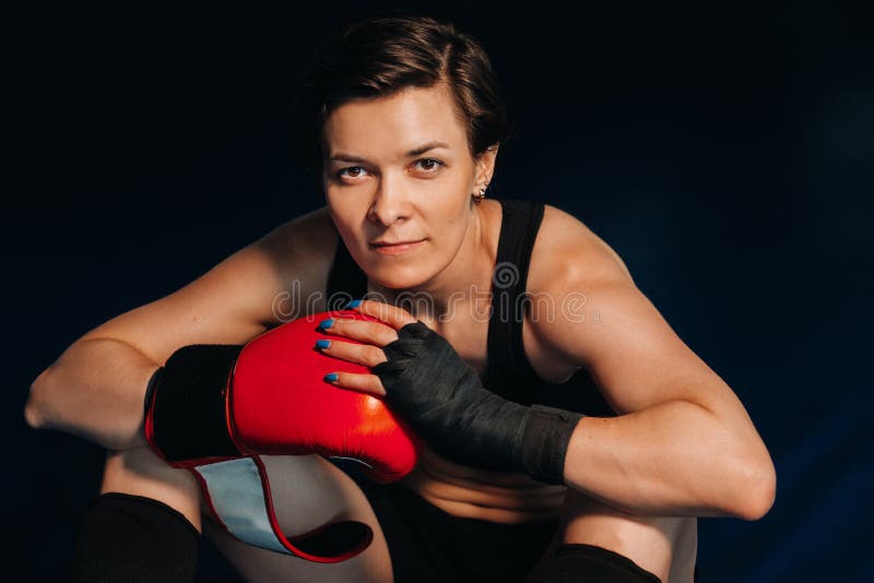 Portrait of a Female Boxer in Red Gloves in the Gym during Training ...