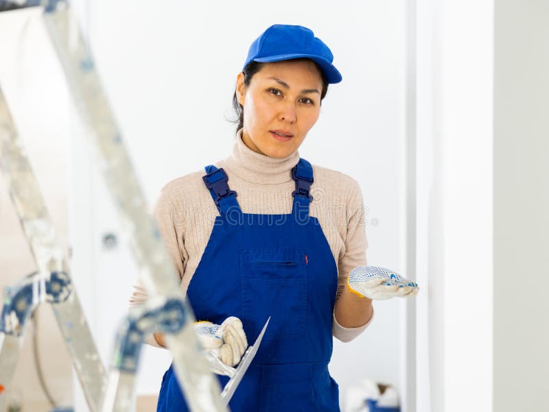 Portrait of Female Builder in Process of Finishing Work in Cottage ...