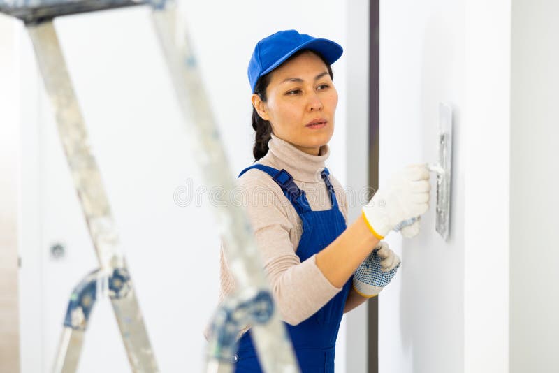 Portrait of Female Builder in Process of Finishing Work in Cottage ...
