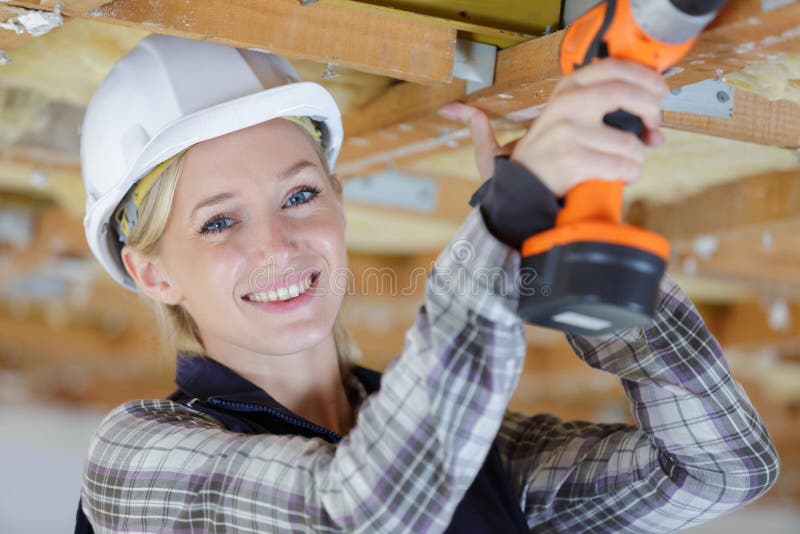 Portrait Female Builder Using Cordless Drill Stock Photo - Image of ...