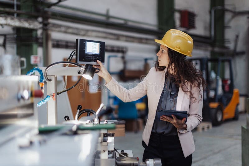 Portrait of Female Chief Engineer in Modern Industrial Factory Using ...