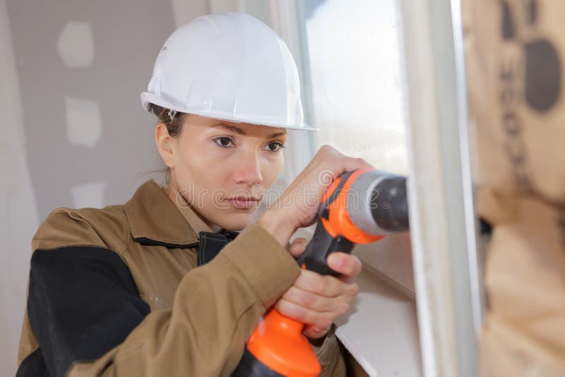 Portrait Female Contractor Using Drill Stock Photo - Image of people ...