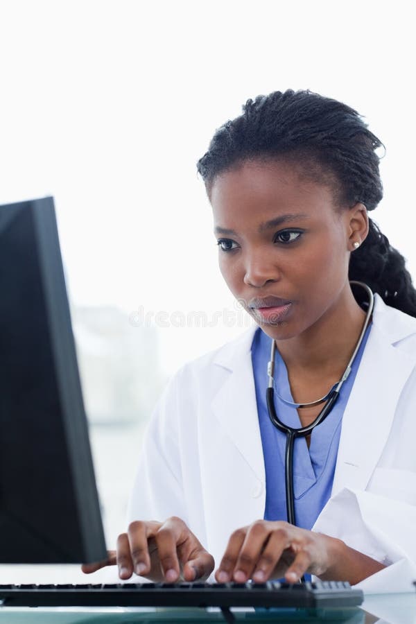 Portrait of a Female Doctor Using a Computer Stock Image - Image of ...