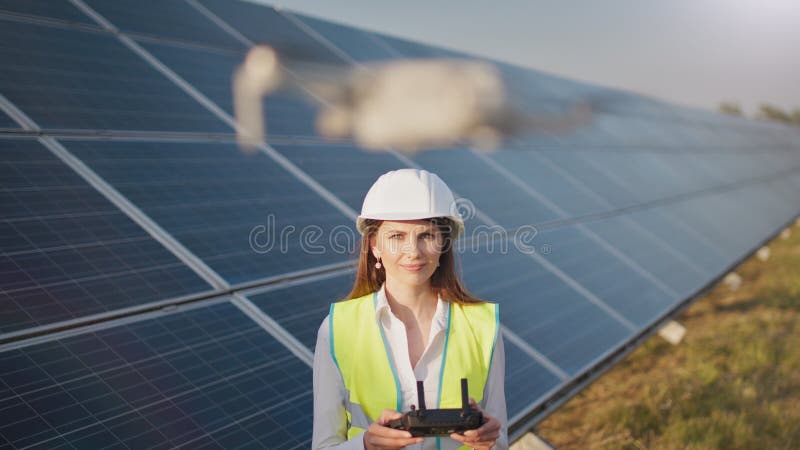 Portrait of a Female Engineer Operating a Drone on the Background of a ...