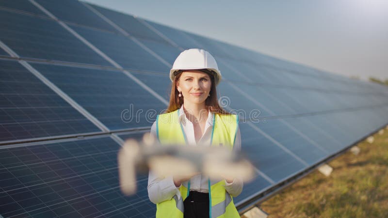 Portrait of a Female Engineer Operating a Drone on the Background of a ...