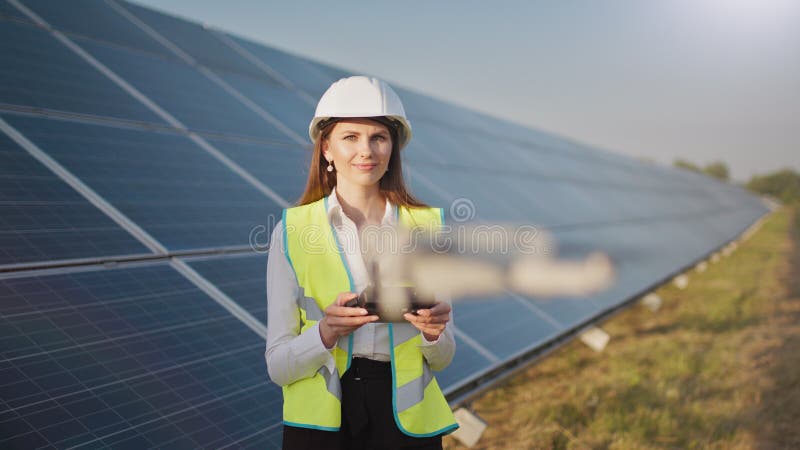 Portrait of a Female Engineer Operating a Drone on the Background of a ...
