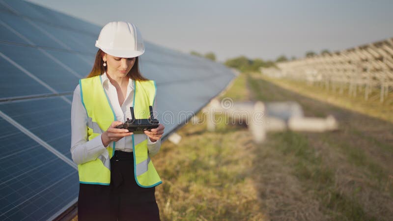 Portrait of a Female Engineer Operating a Drone on the Background of a ...